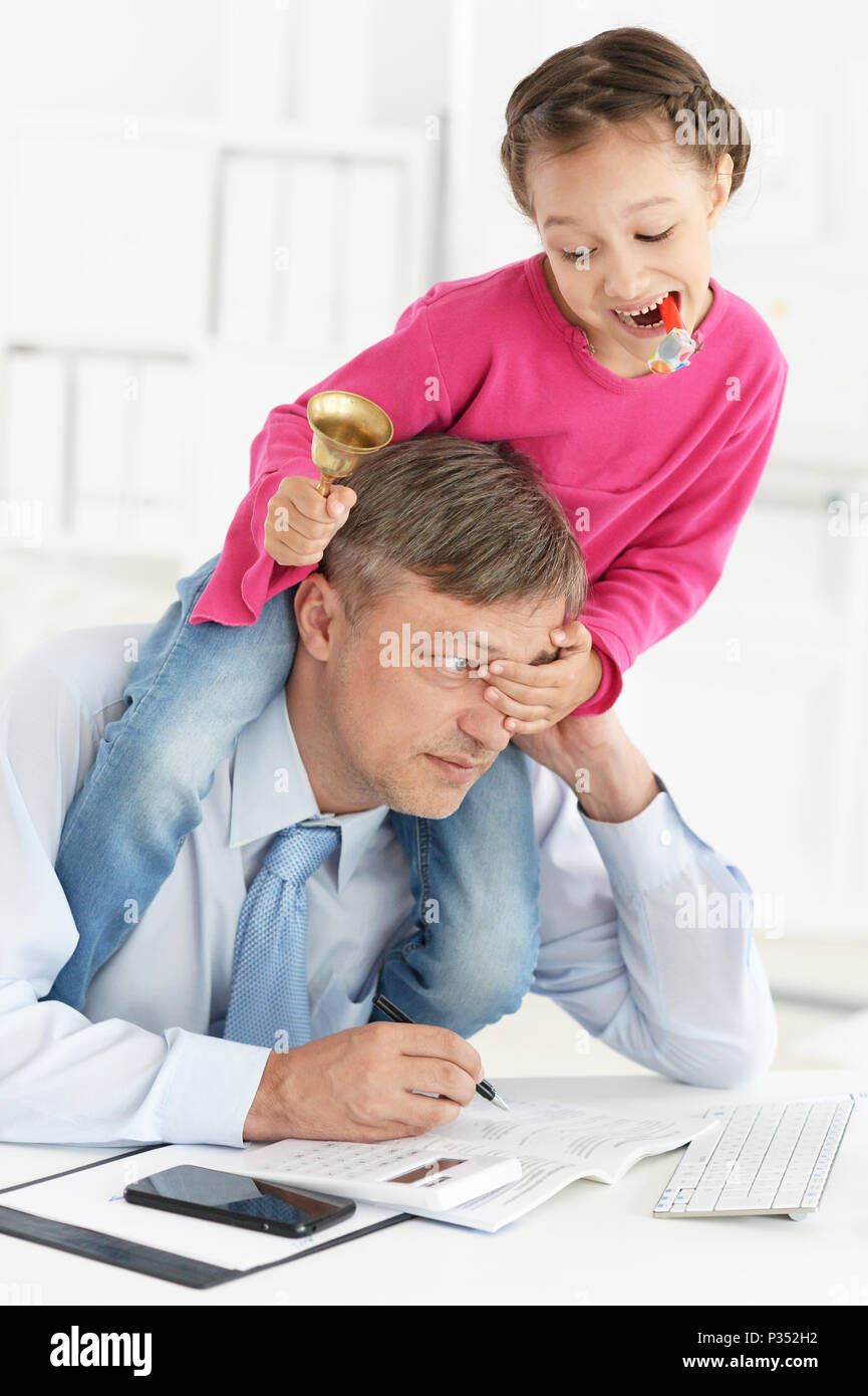 father trying to work Stock Photo - Alamy