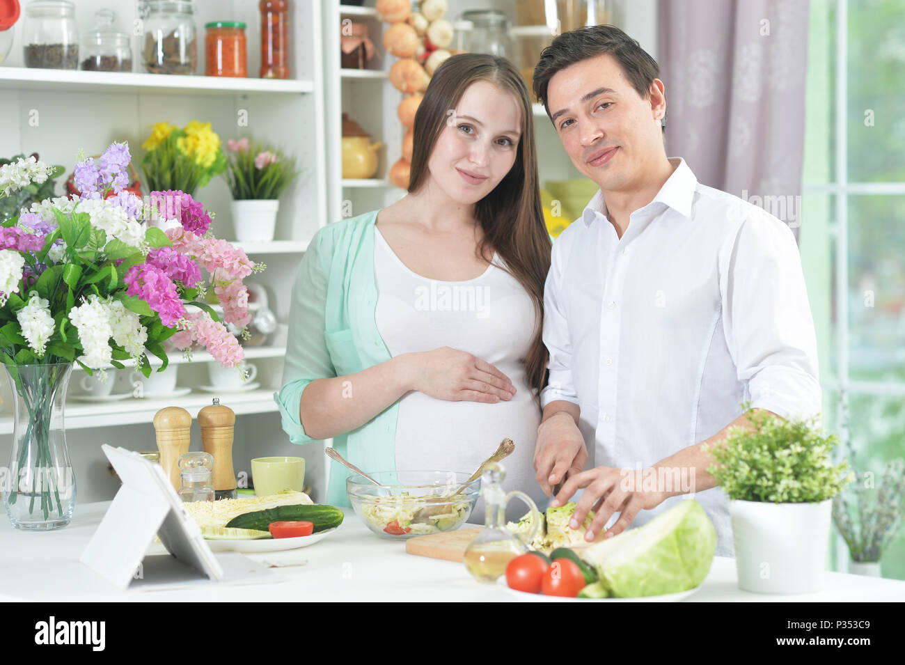 husband and wife cooking together Stock Photo - Alamy