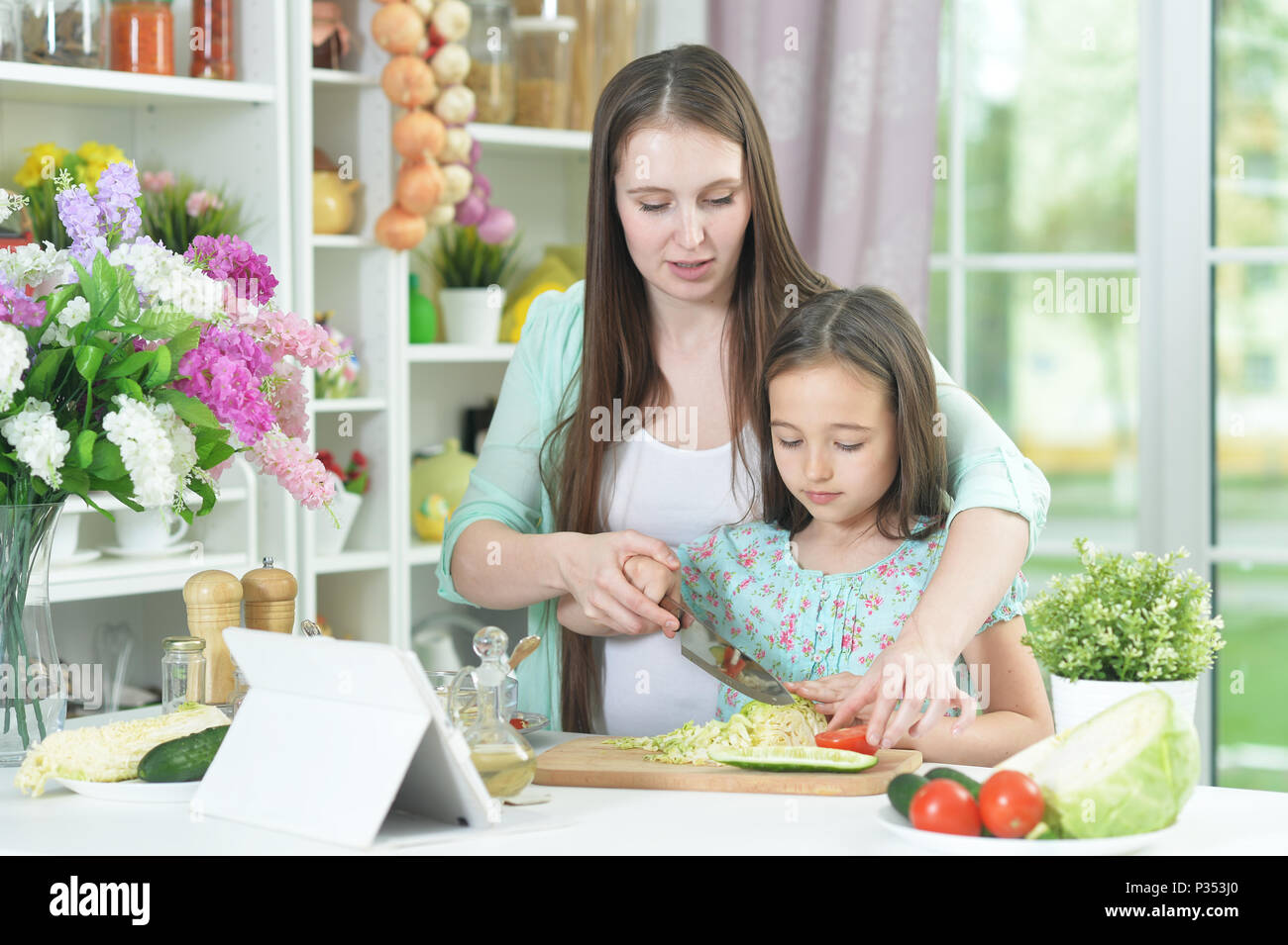 mother and daughter cooking together Stock Photo - Alamy