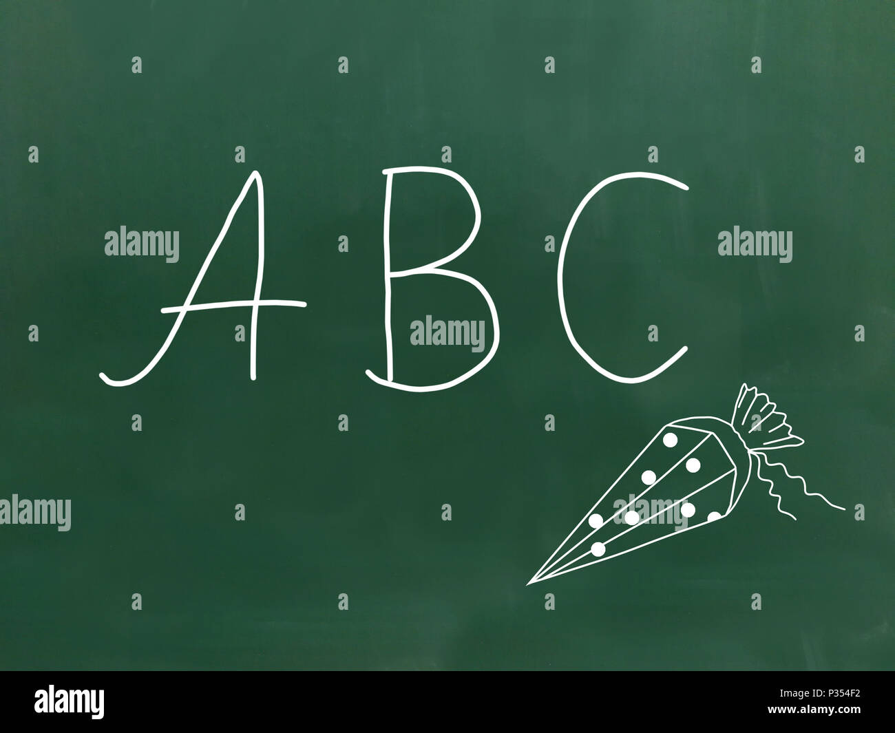 The letters ABC handwritten with chalk on a green chalkboard Stock ...