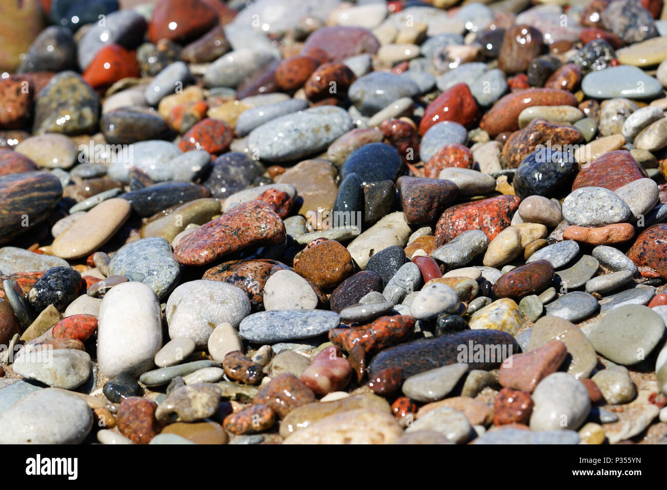 Beautiful colorful rocks on beach Stock Photo - Alamy