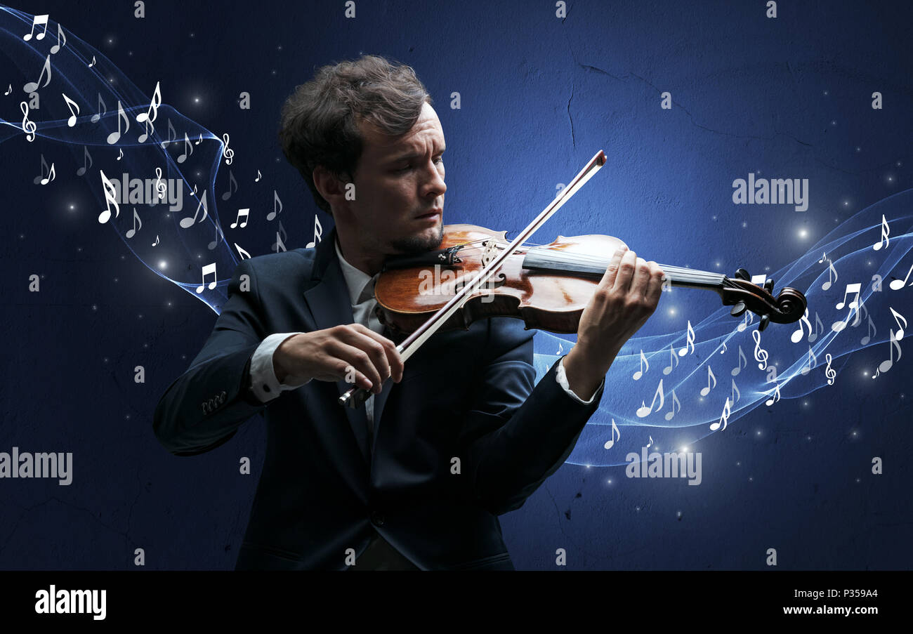 Lonely musical composer with violin and sparkling musical notes around ...