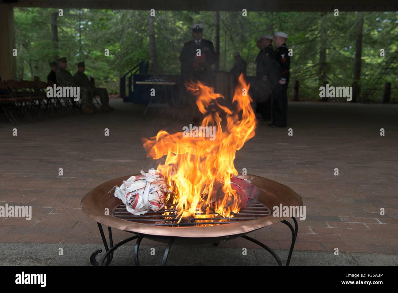 BANGOR, Wash. (June 14, 2018) Flags are retired by Sailors assigned to ...