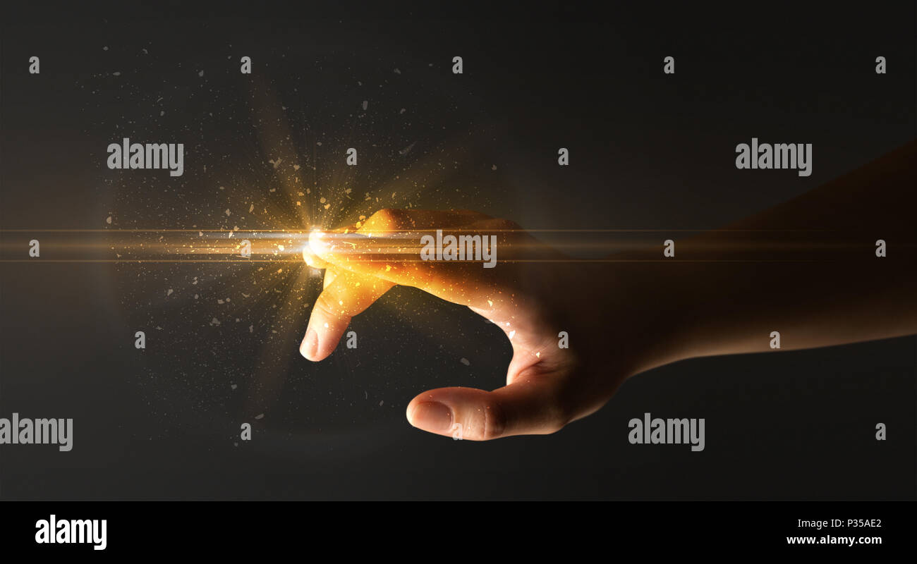 Female finger touching a beam of light Stock Photo - Alamy