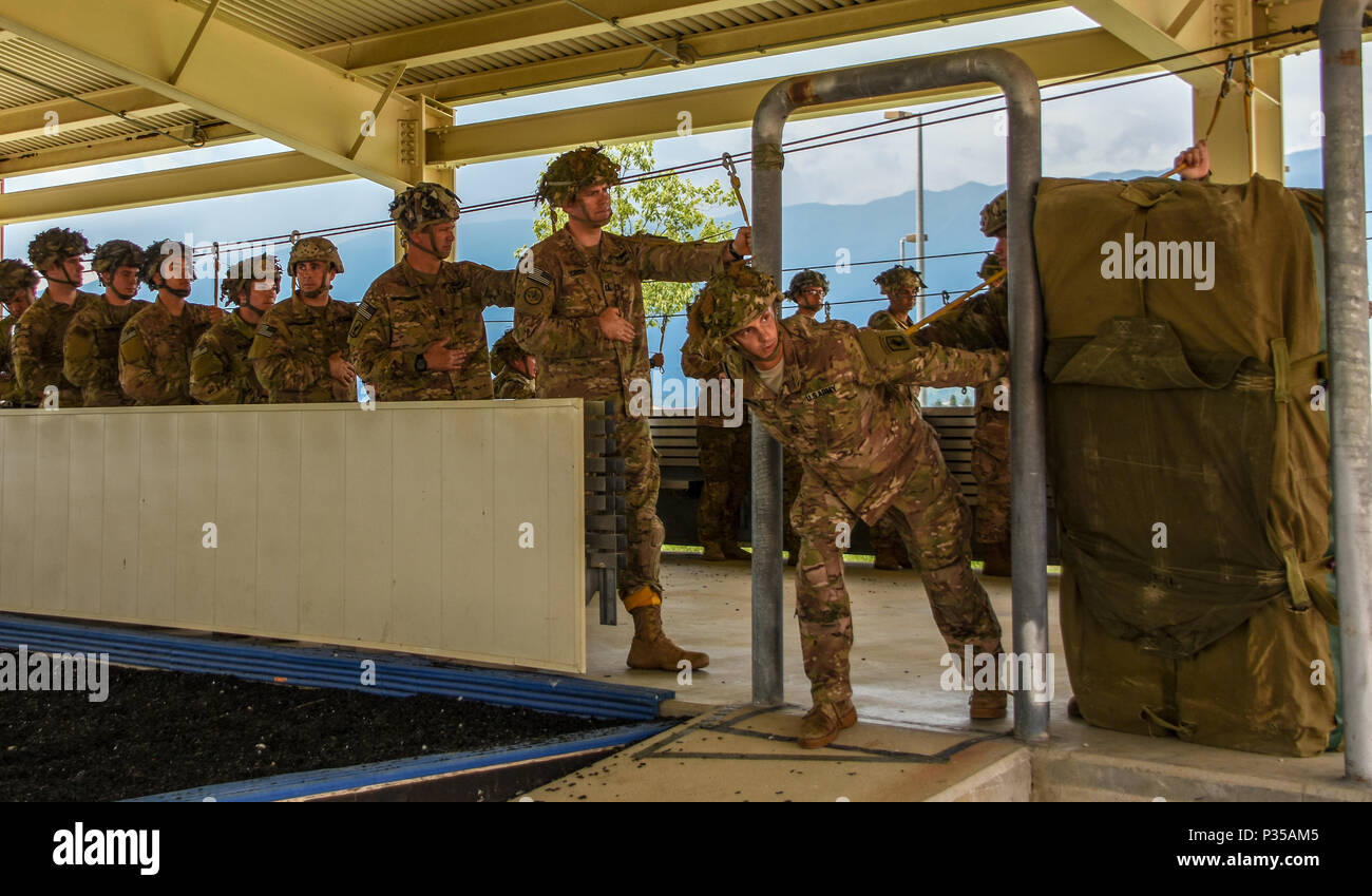 A jumpmaster from the 173rd Airborne Brigade conducts mock door drills ...