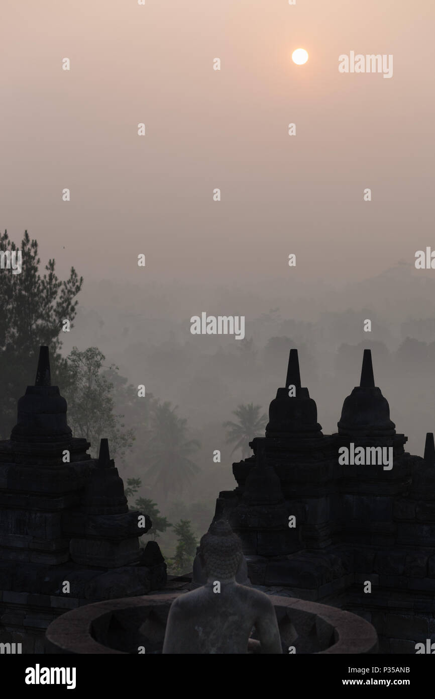 Rising sun behind the stupas of Borobudur Temple, Java, Indonesia Stock ...