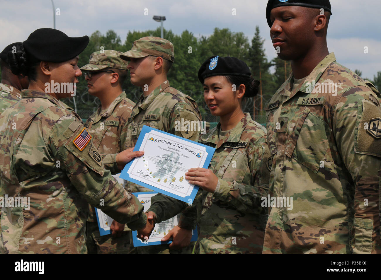 SPC Shary H. Nguyen receives the SHARP Initiative Award during the 7th ...