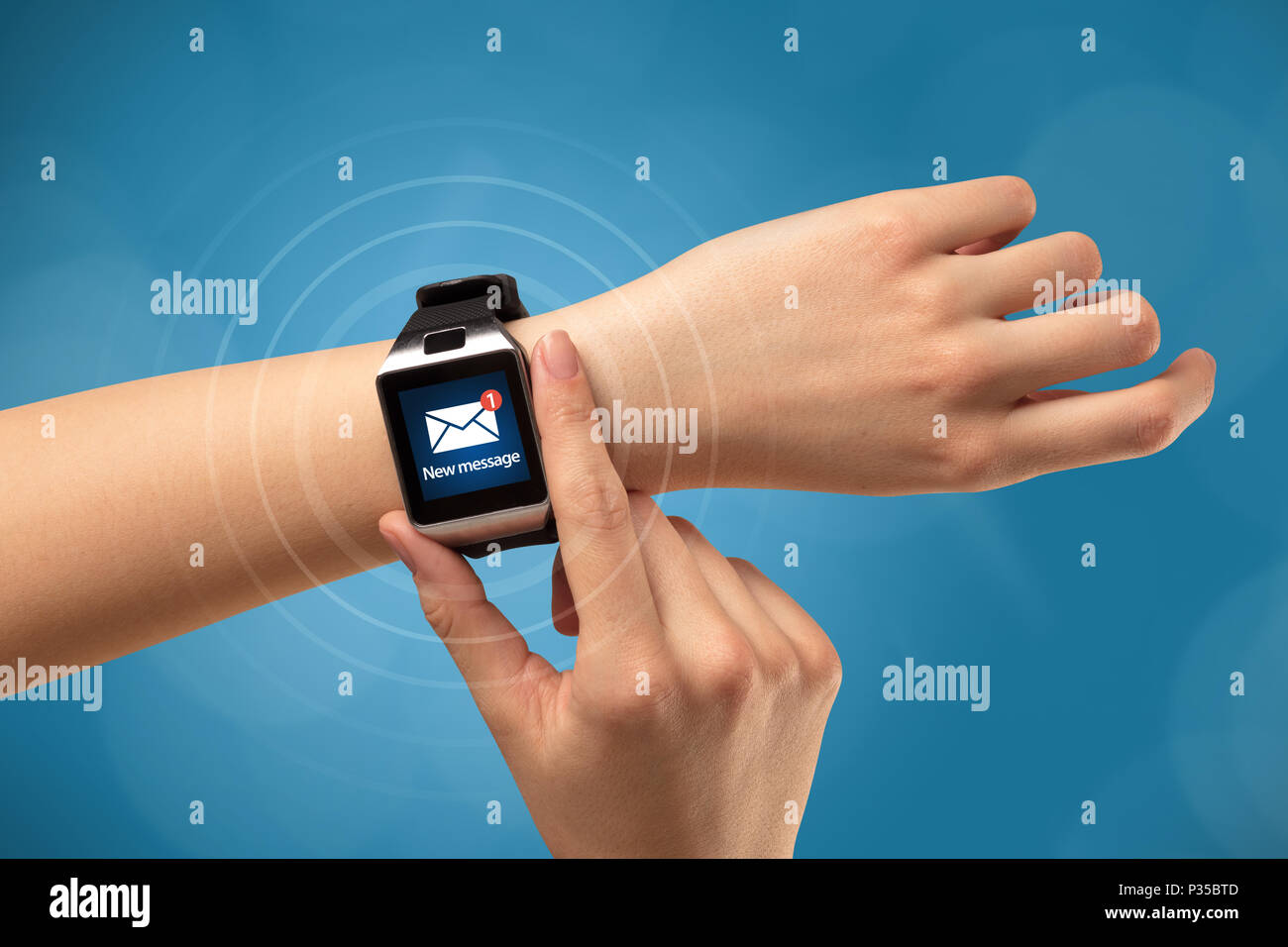 Female hand receives new message on her smartwatch Stock Photo - Alamy