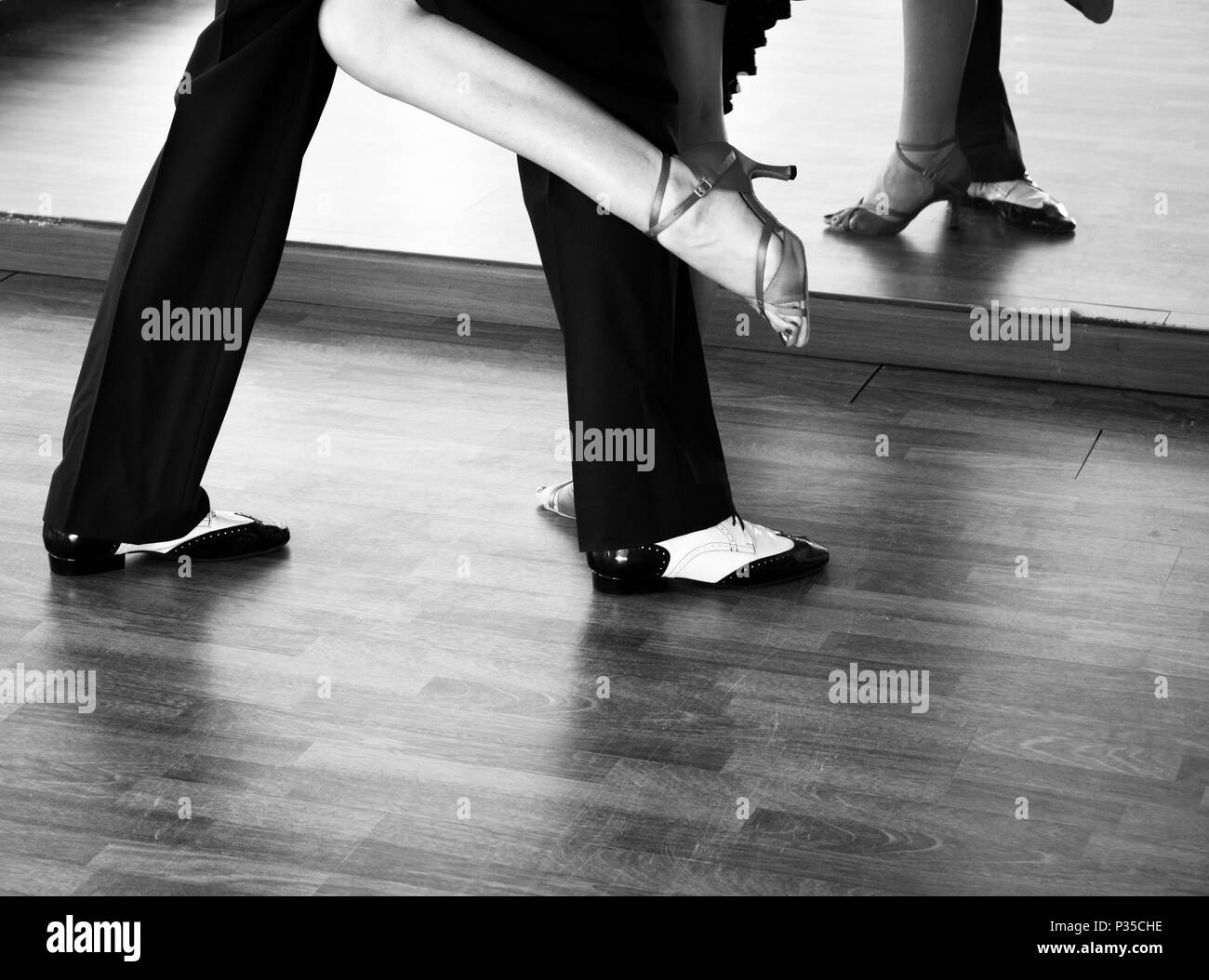 Ballroom dance salsa dancer instructors man and woman couple dancing in ...