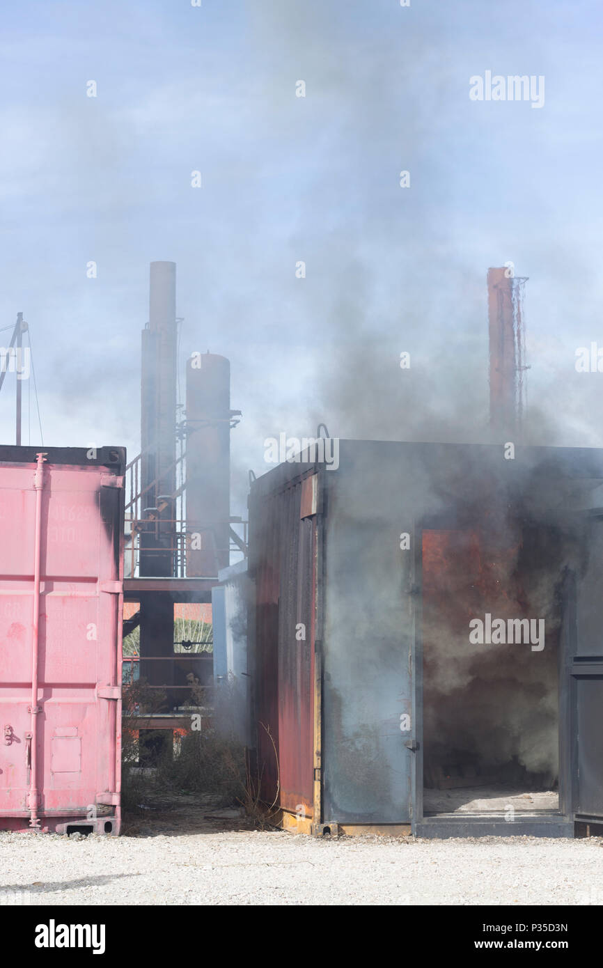 Firefighter putting out fire training station extinguisher backdraft ...