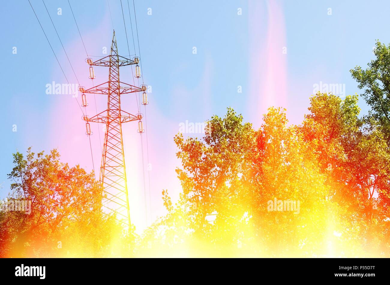 Pylon of high voltage and flames. Concept of summer fires and energy ...
