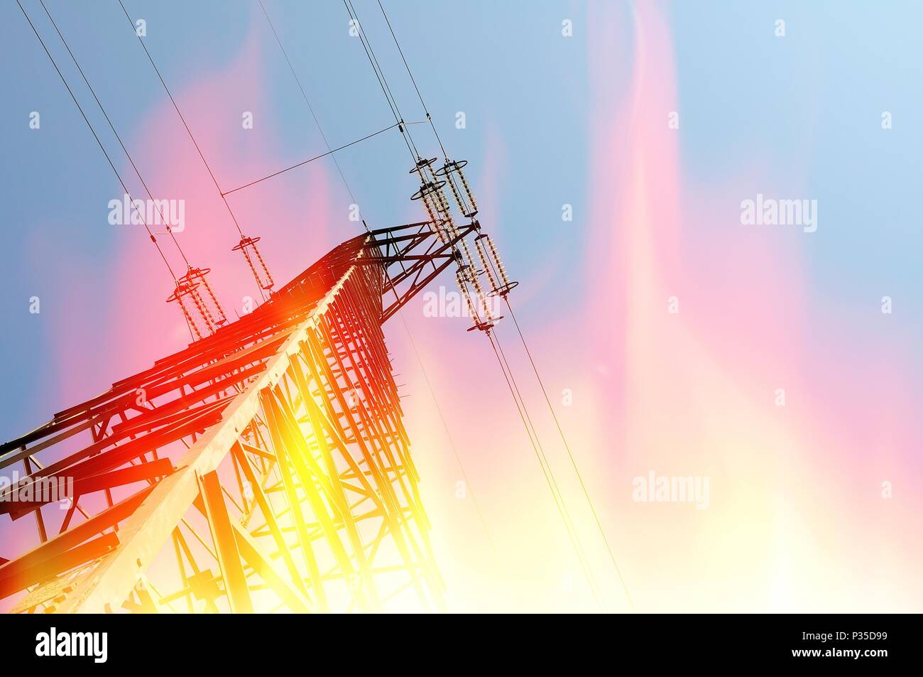 Pylon of high voltage and flames. Concept of summer fires and energy ...