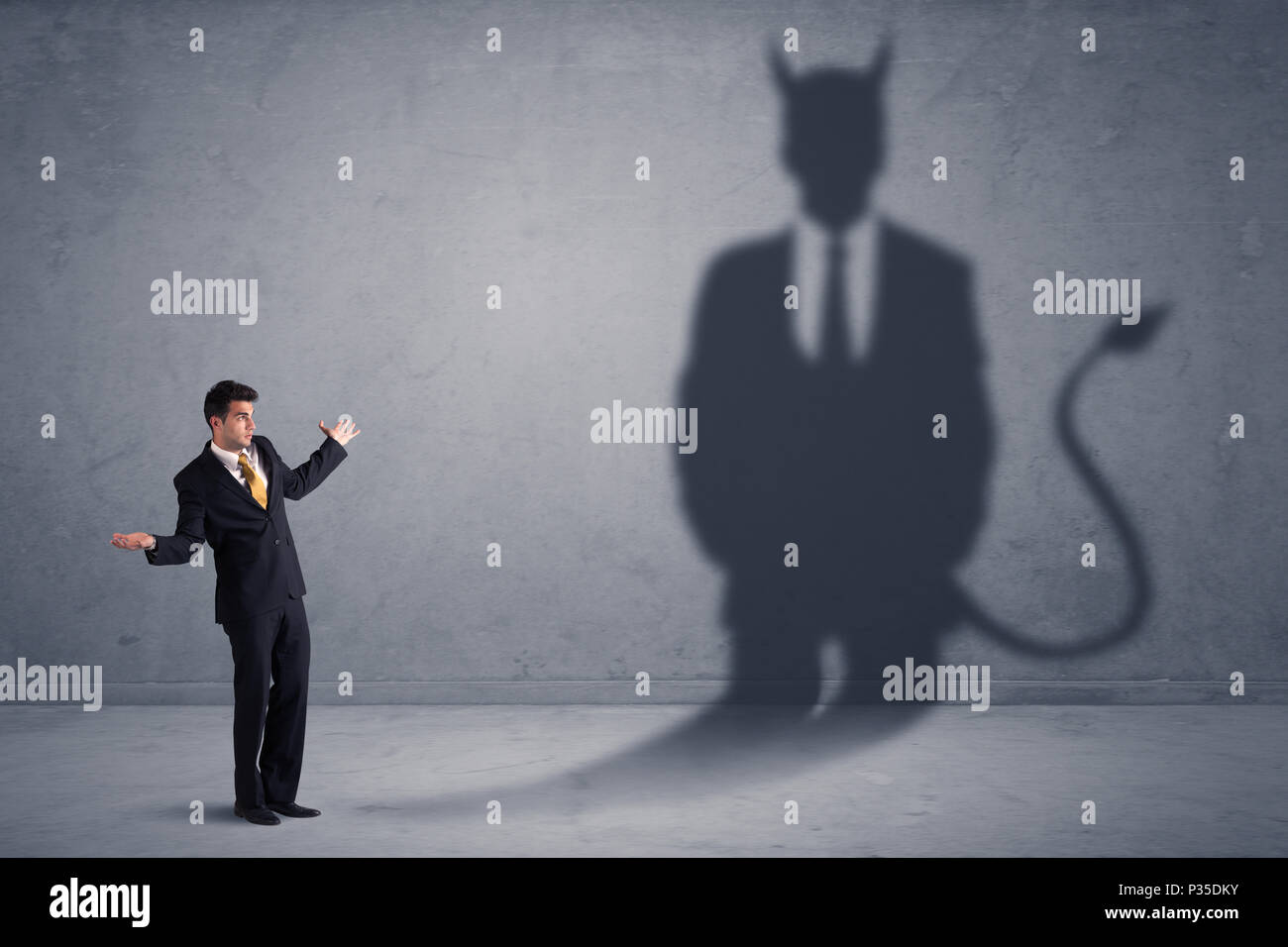 Business man looking at his own devil demon shadow concept background ...