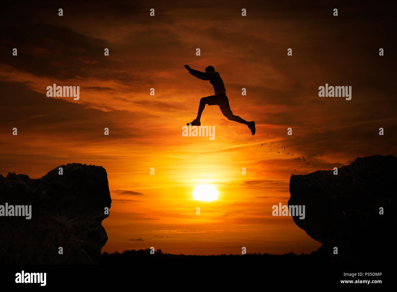 Silhouette Man Jumping Over Cliff High Resolution Stock Photography and ...
