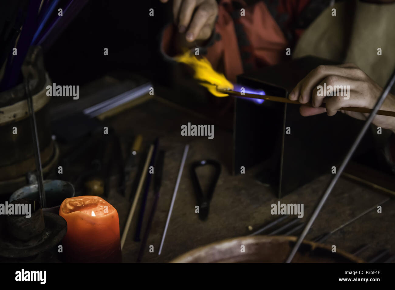 Blowing glass in a traditional way, art detail Stock Photo - Alamy