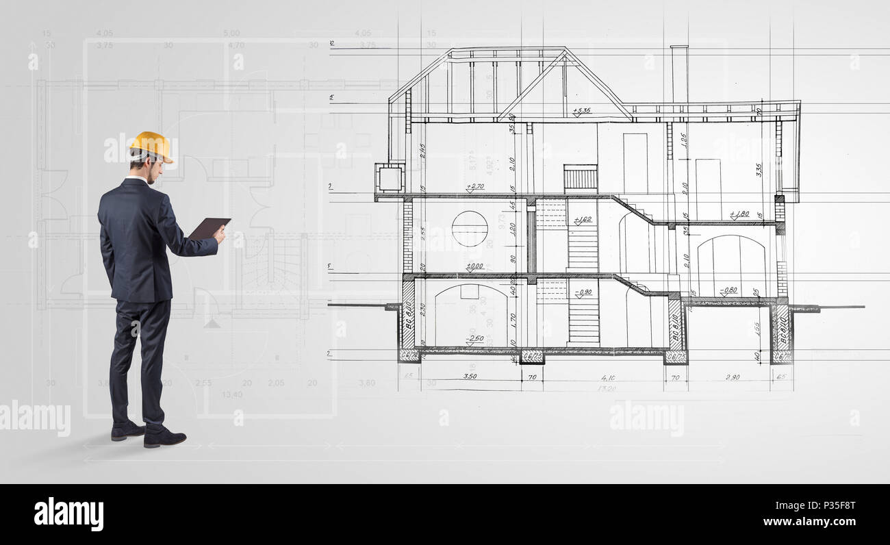 Architect watching a 2 dimension house plan Stock Photo - Alamy