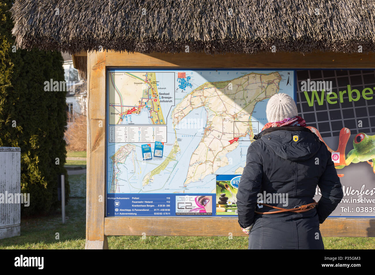 Breege, Germany, tourist in front of an information board on Ruegen ...
