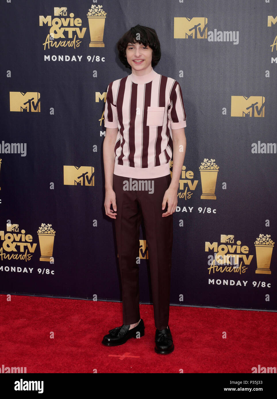 Finn Wolfhard attending the 2018 MTV Movie and TV Awards held at the ...