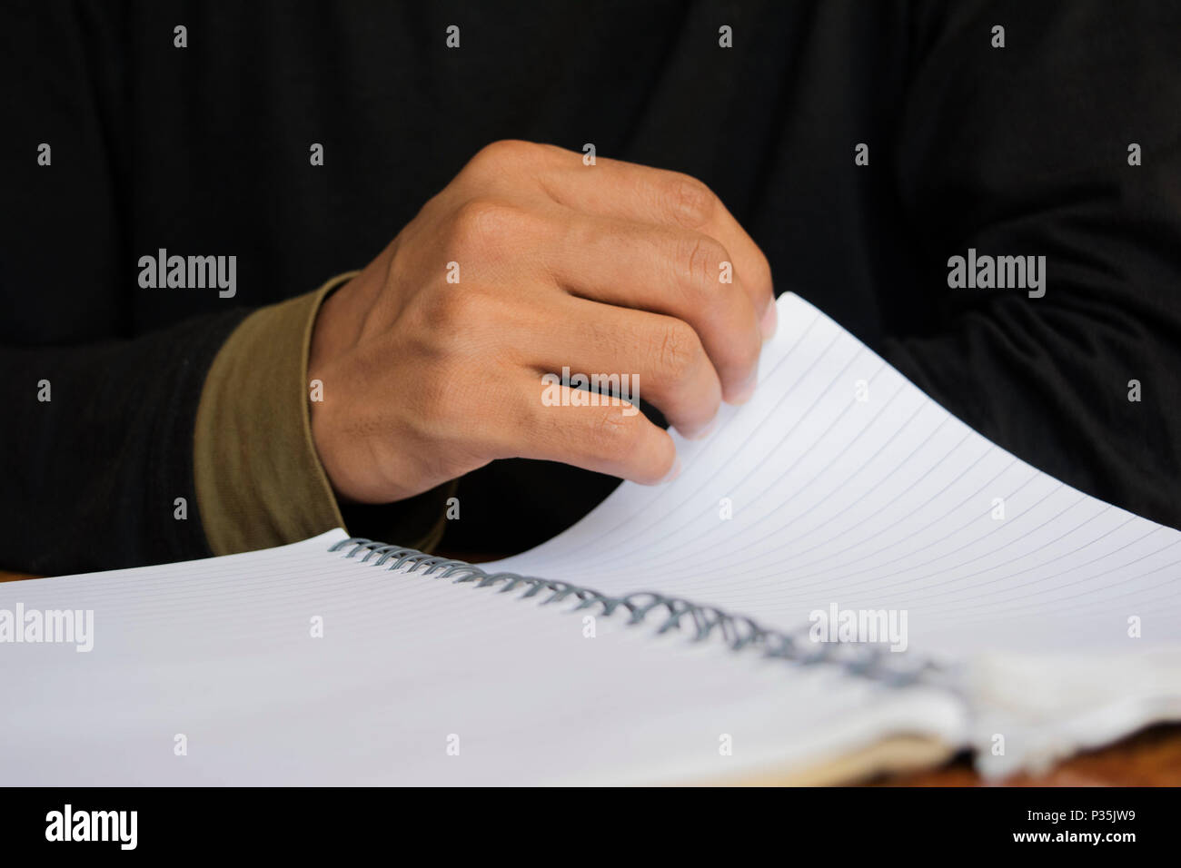 Indian male reading a note Stock Photo - Alamy