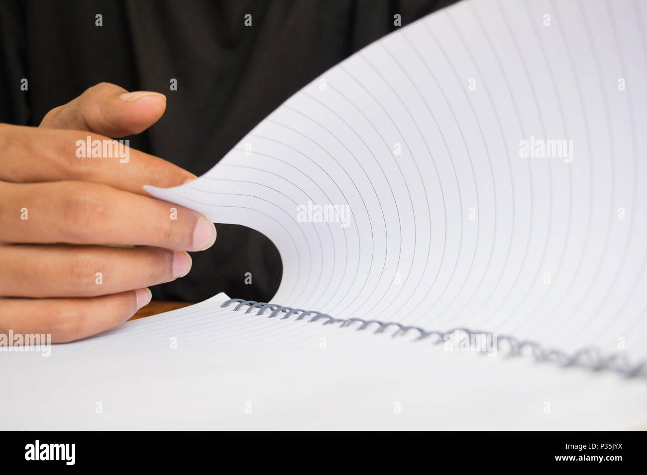 Indian male reading a note Stock Photo - Alamy