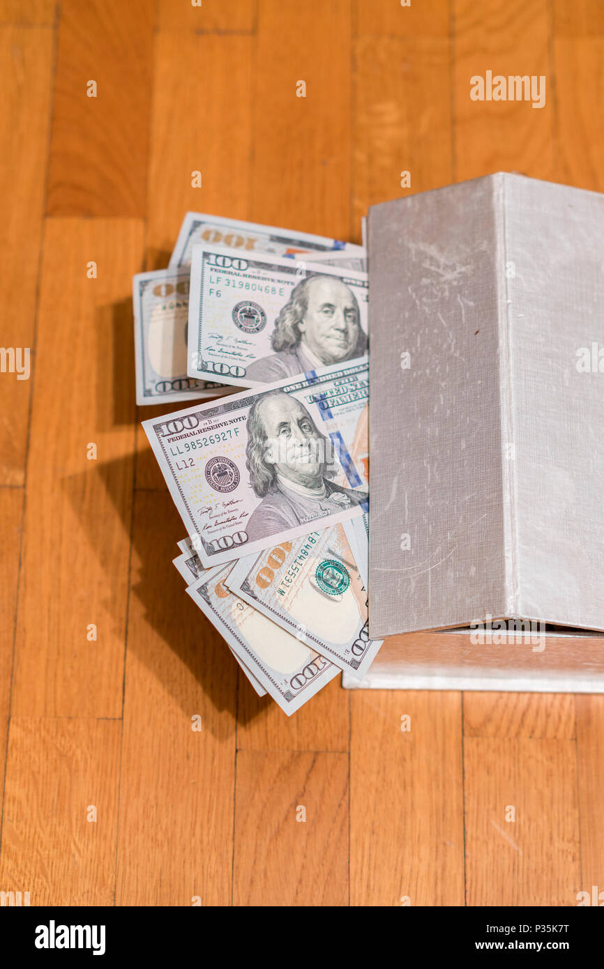 dollars in a box. Small treasure box full with money, US 100 dollar ...