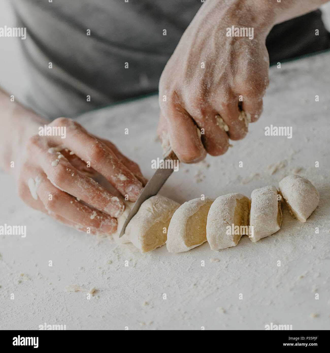 Process of cutting dough making dish cooking homemade dough. Chef makes ...