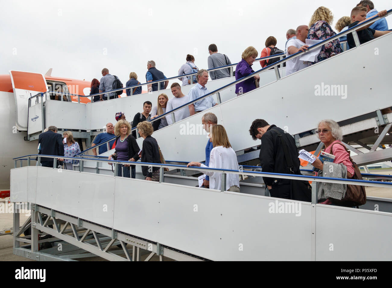 Bristol Airport, UK. Passengers board an Easyjet aircraft using an ...