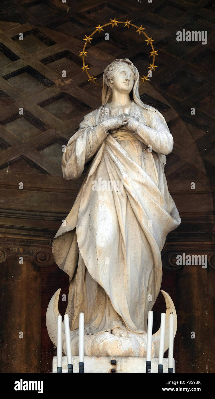Virgin Mary statue on Clock tower, Modena town Hall on Piazza Grande, a ...
