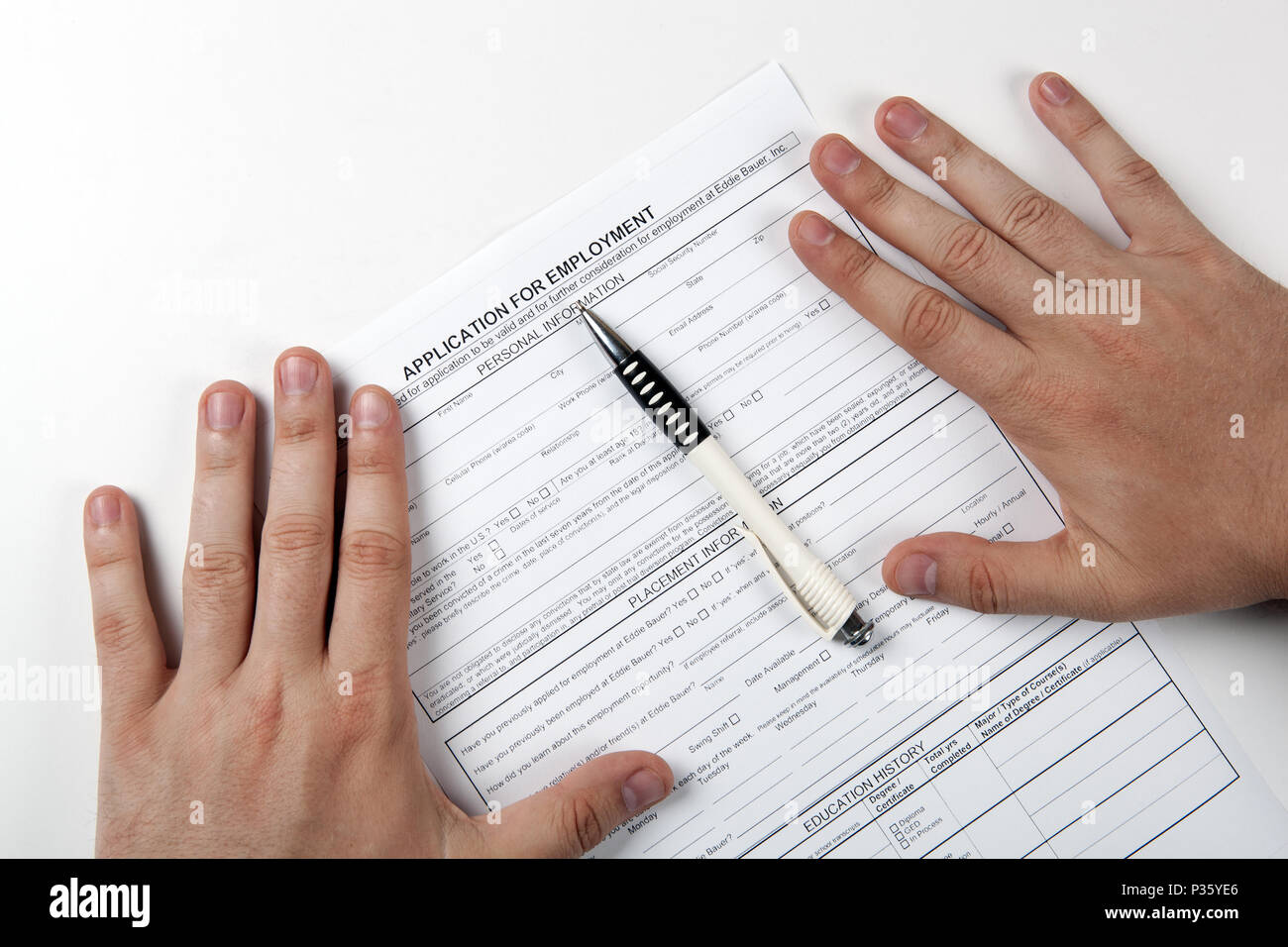 human hand and the form of the document application for employment ...