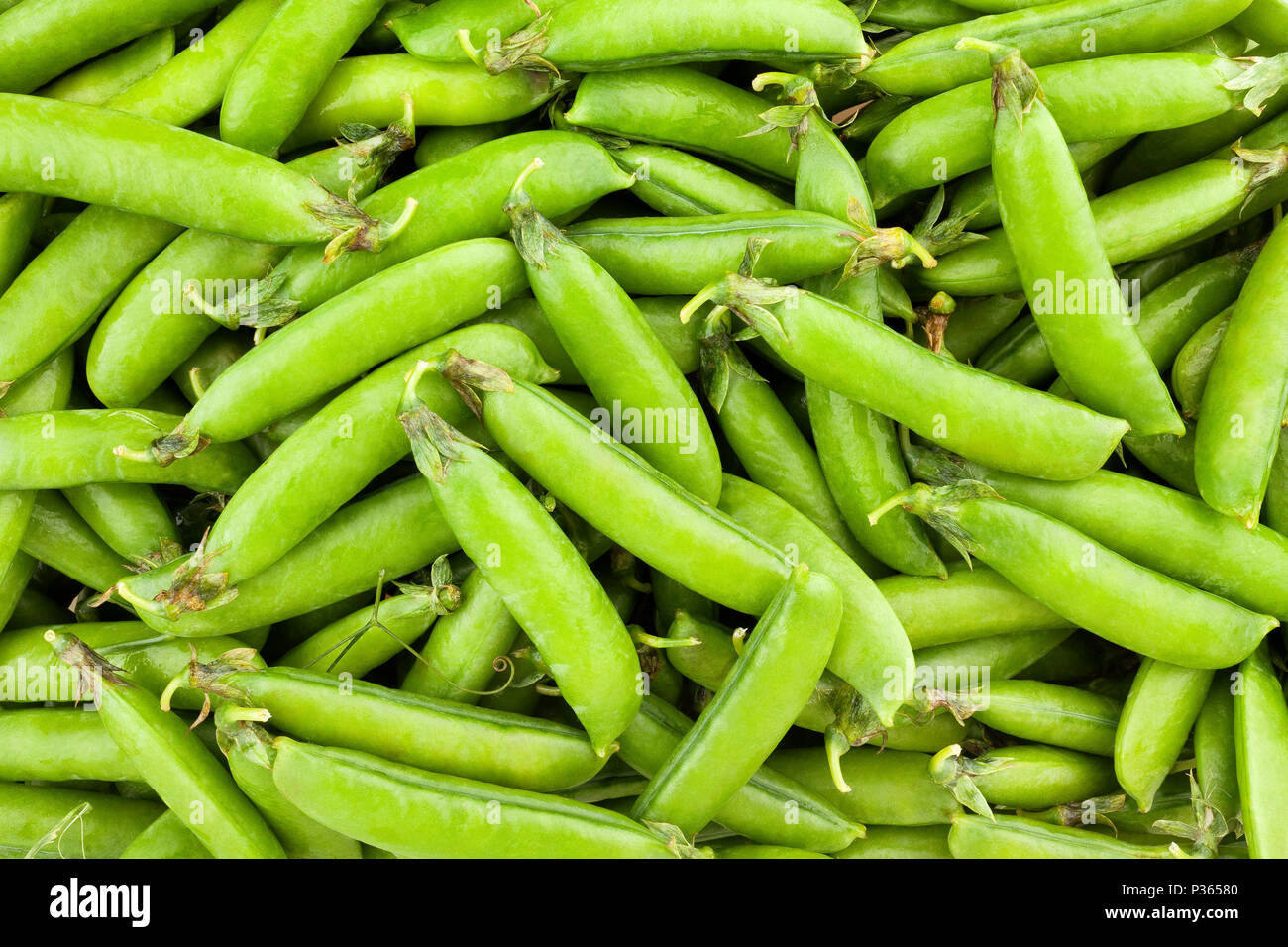 peas pods background texture Stock Photo - Alamy