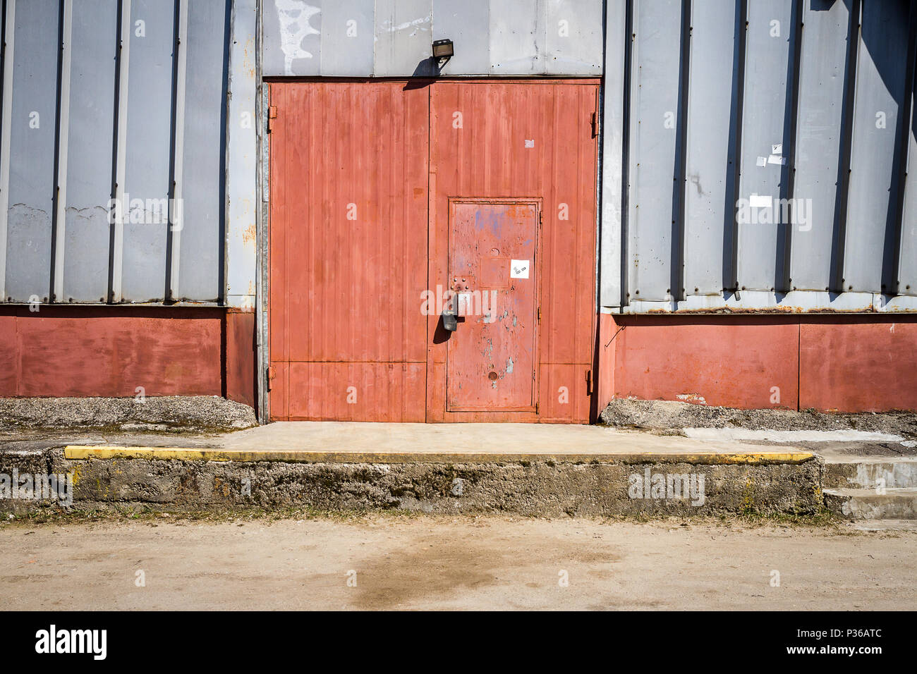 Old metal warehouse door, hangar gate. Industrial iron door Stock Photo ...
