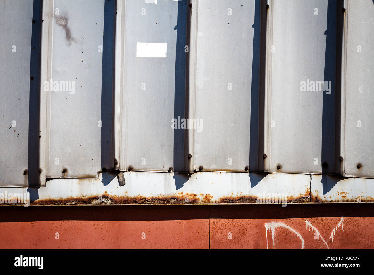 Old rusty metal warehouse wall texture background. Close up of rough ...