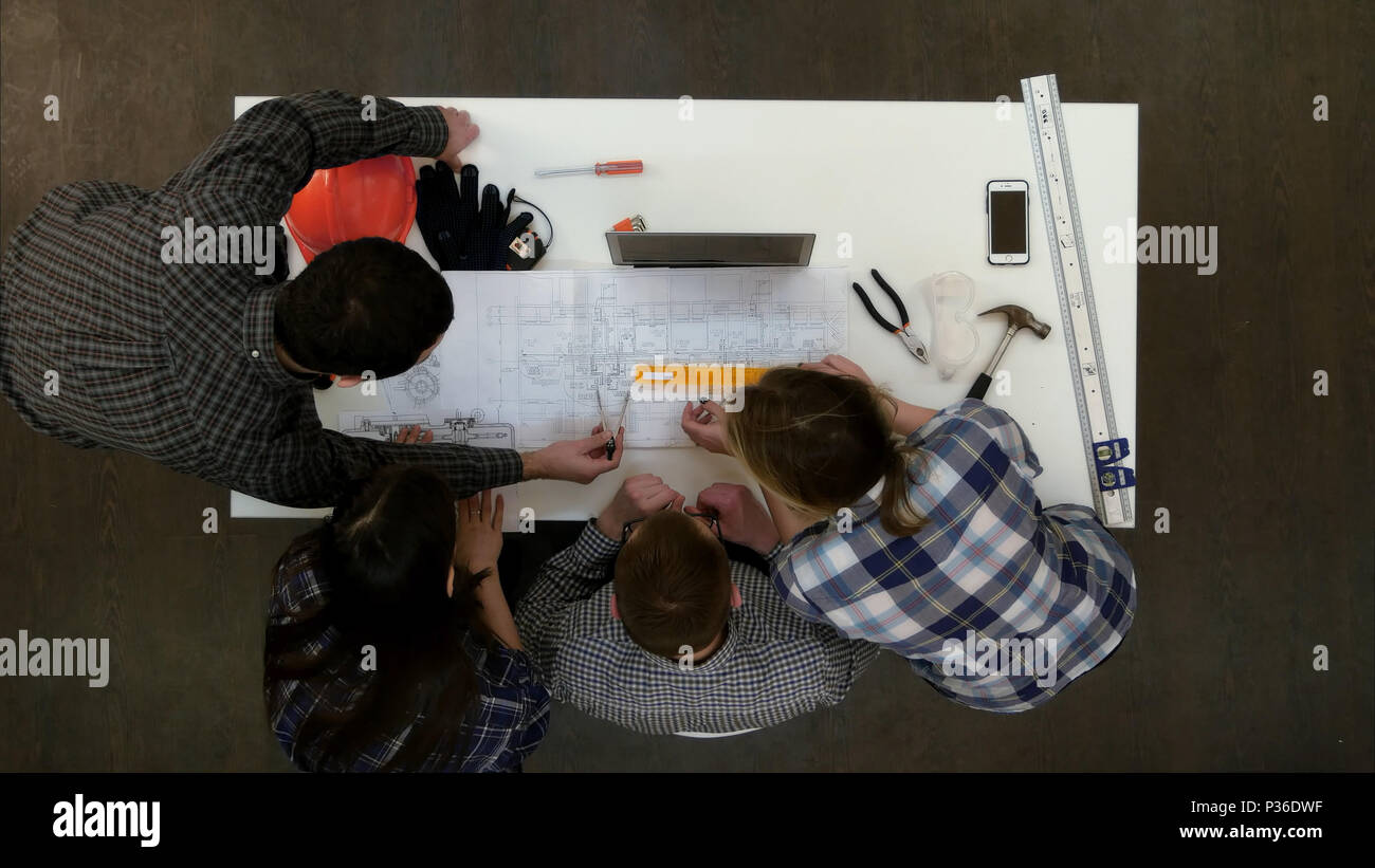 Young architects checking drawing measurements with divider Stock Photo ...