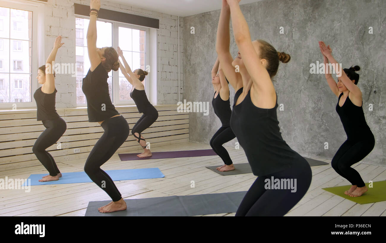 Women doing yoga sun salutation hi-res stock photography and images - Alamy