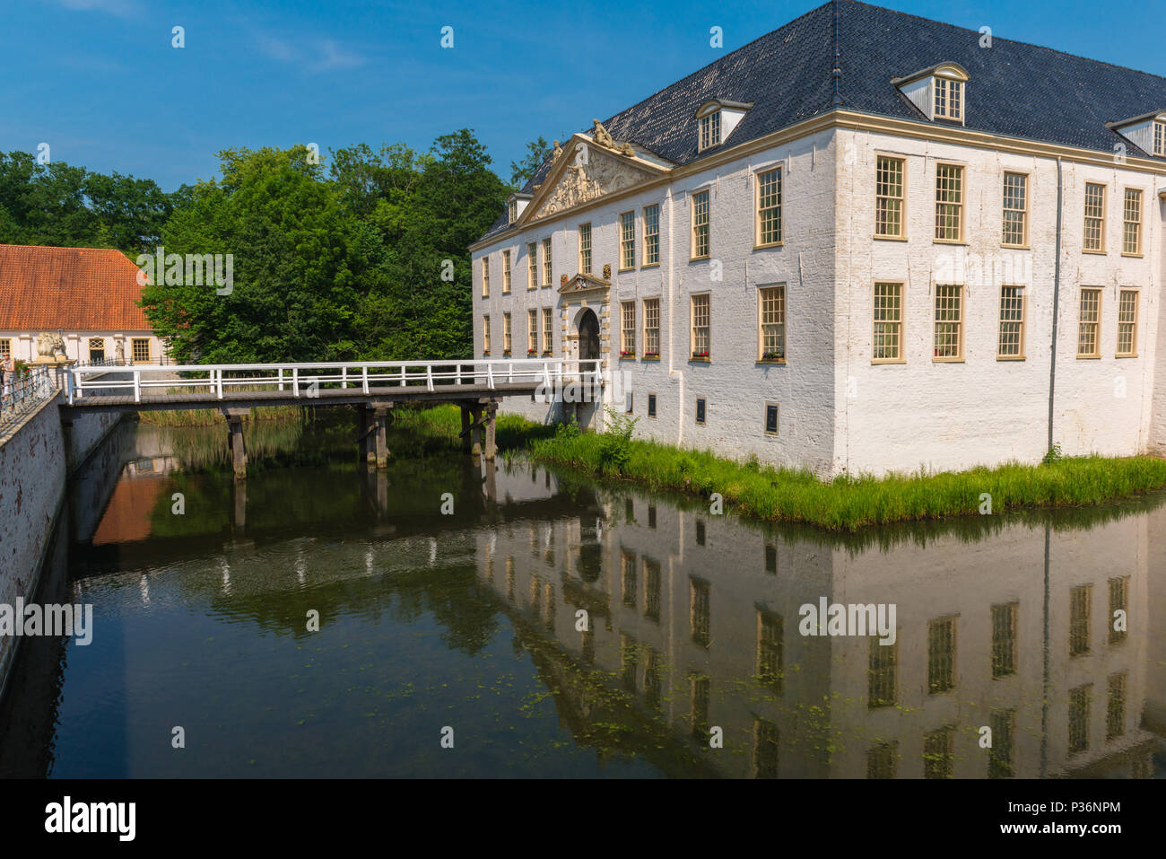 Dornum Castle, built in 1698, sorrounded by a moat, function today, a ...