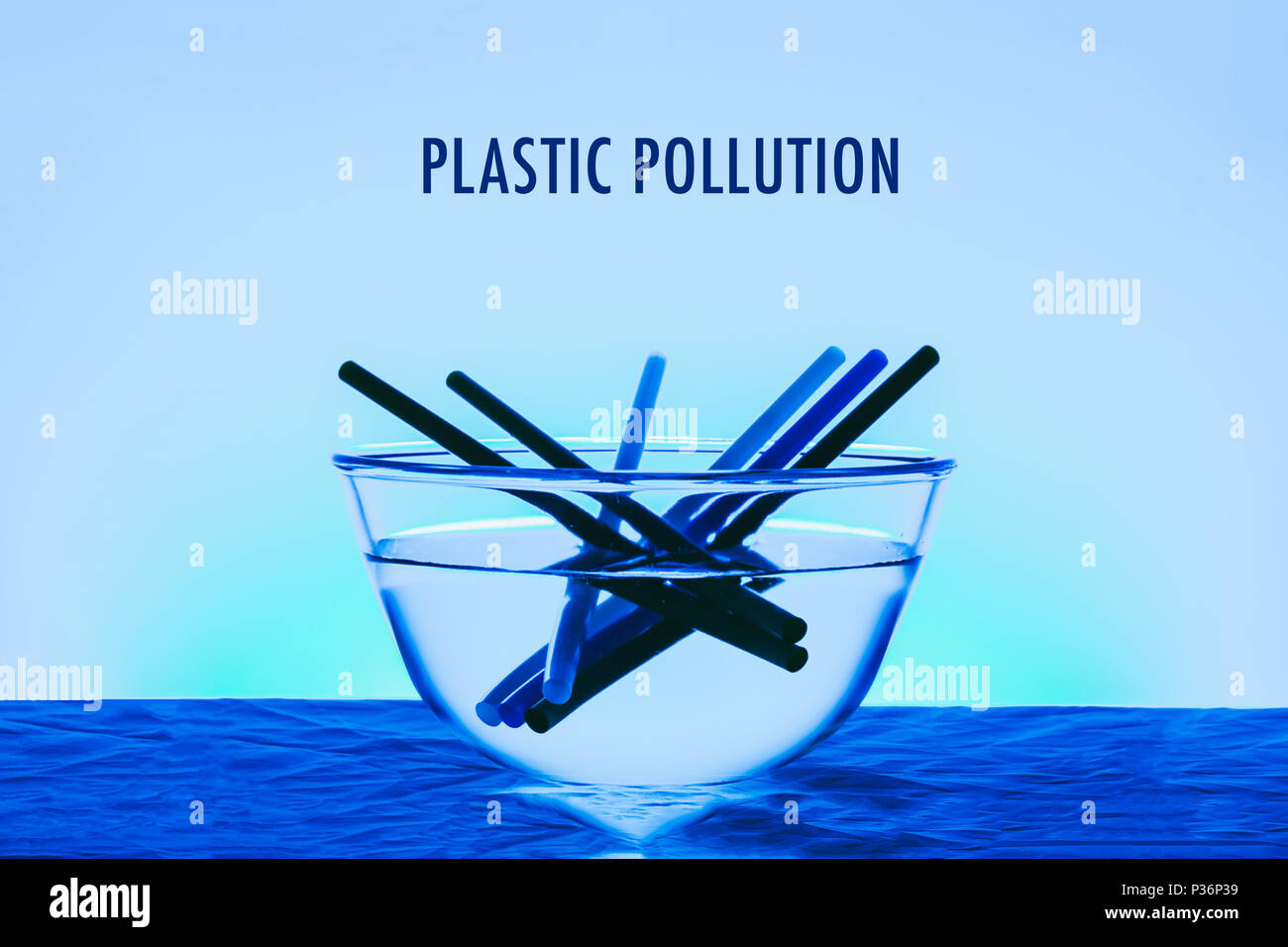 Plastic pollution title in the ocean concept photo with glass of bowl ...