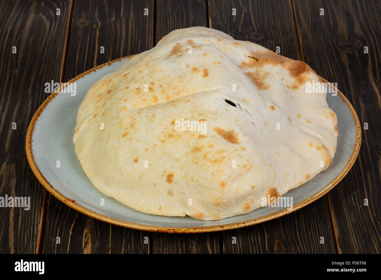 Handmade bread Lepeshka over wooden Stock Photo - Alamy