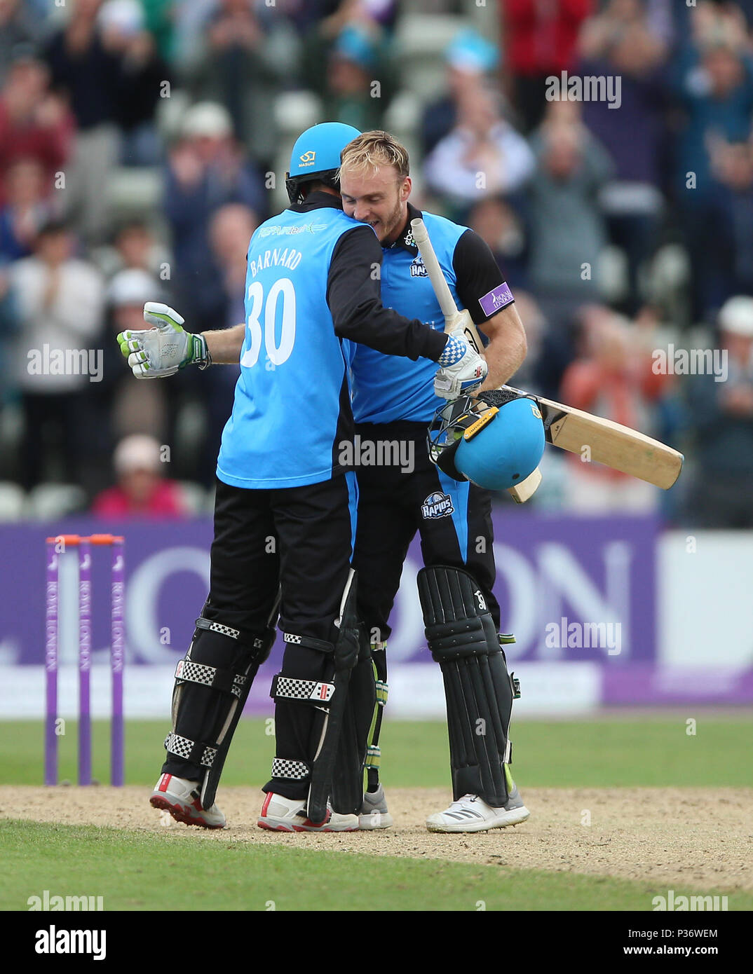 Worcestershire's Ben Cox (right) celebrates his century with Ed Barnard ...