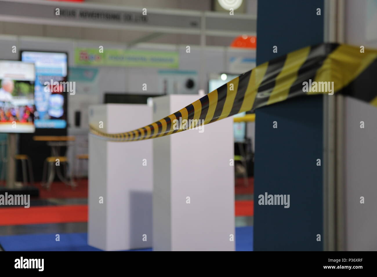 Barrier tape for no entry at an exhibition.do not cross ribbons.;Yellow ...