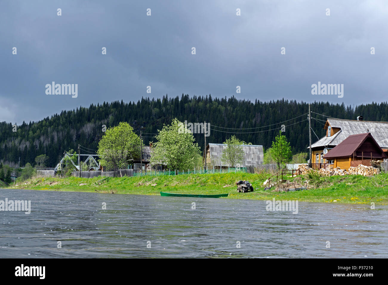 landscape of a small Ural village with wooden houses of traditional ...