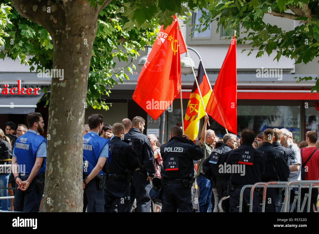 Frankfurt, Germany. 17th Jun, 2018. Counter protesters carrying a flag ...