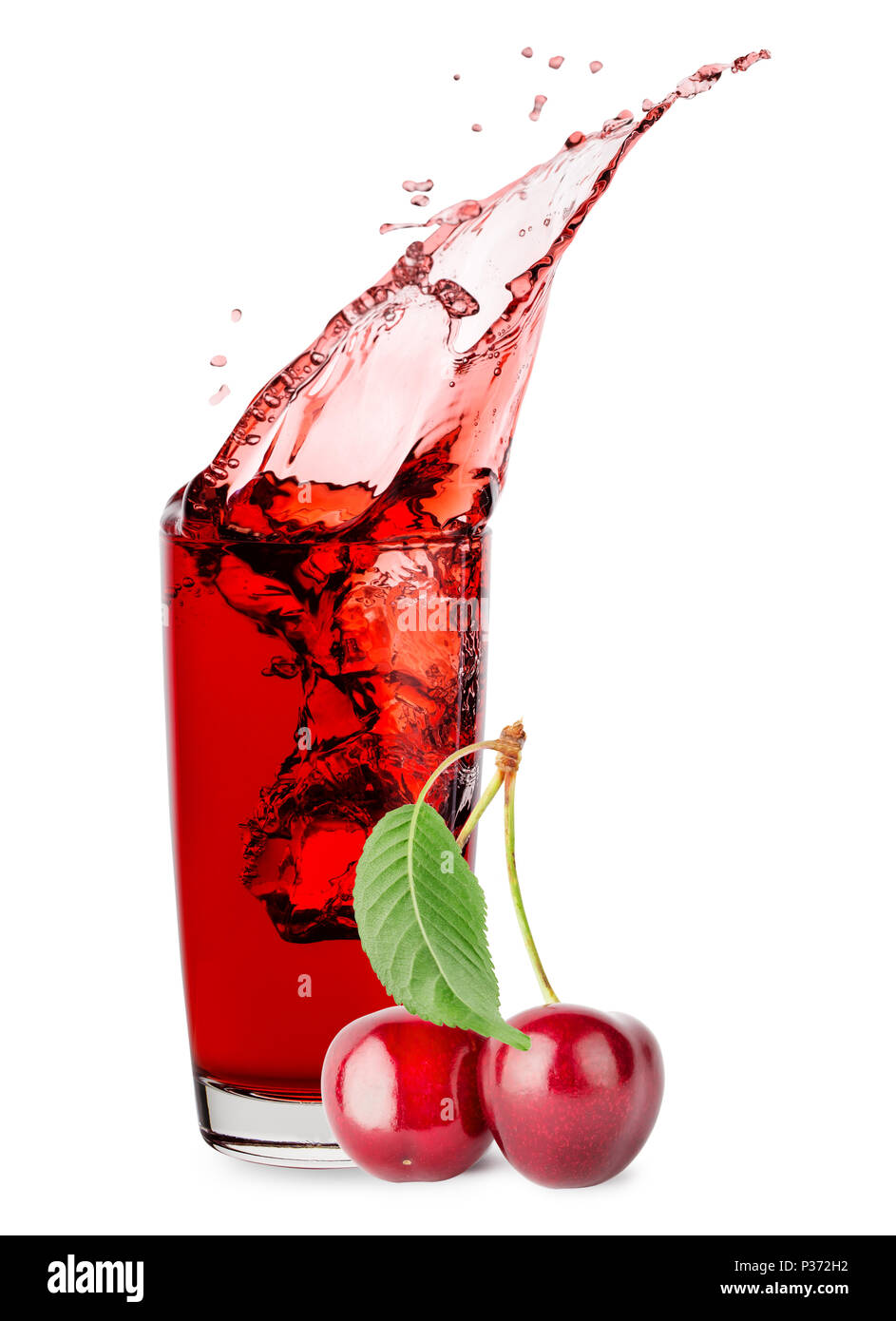 Splash in glass of cherry juice with berries isolated on white ...