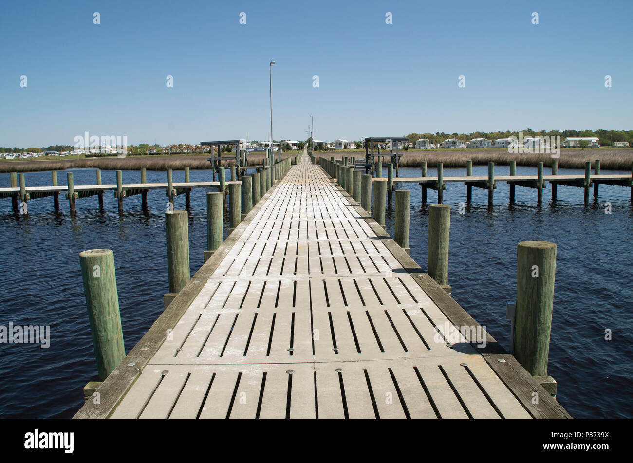 A fishing pier stands ready for action in a campground in Stella ,North ...