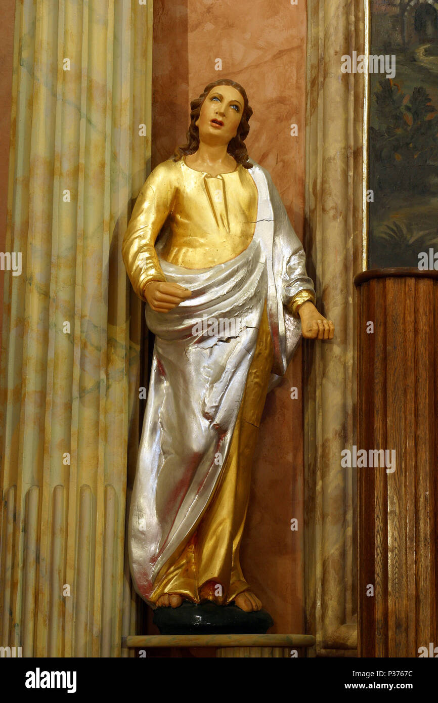 Saint John, statue on the main altar in the Parish Church Exaltation of ...