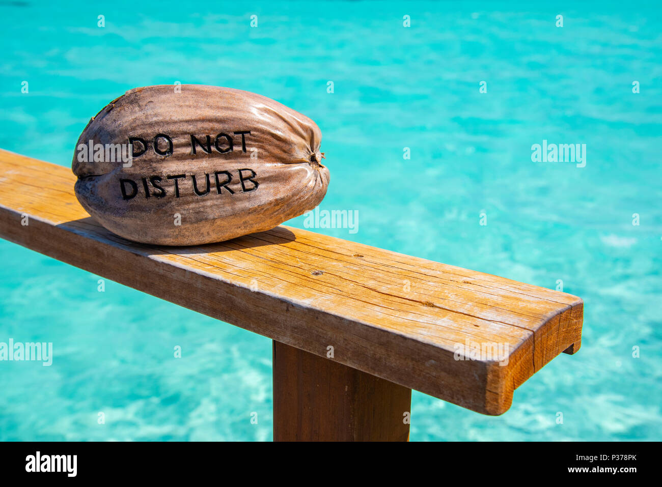Do not disturb sign on coconut with wonderful beach Stock Photo - Alamy