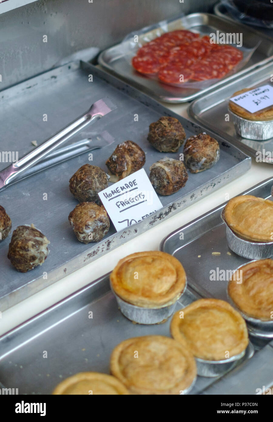 Faggots, an english delicacy in a butchers window Stock Photo - Alamy