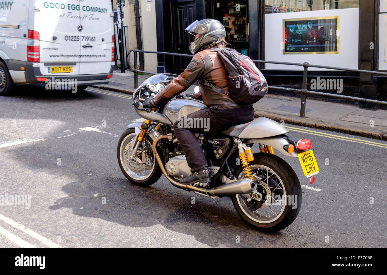Man riding a Triumph Truxton motorbike in Bath Somerset england UK ...