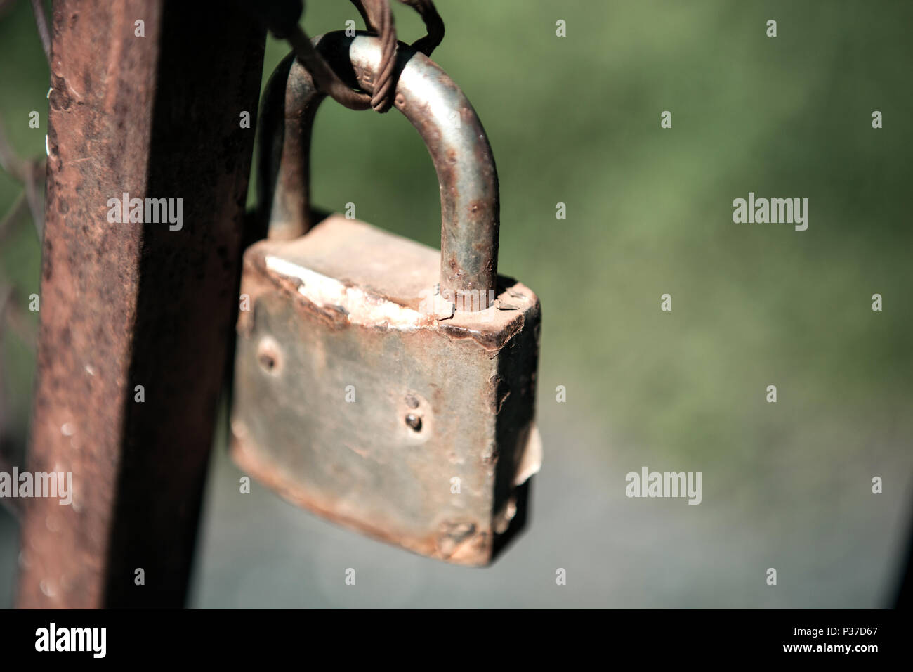 Old rusty lock hangs hi-res stock photography and images - Alamy