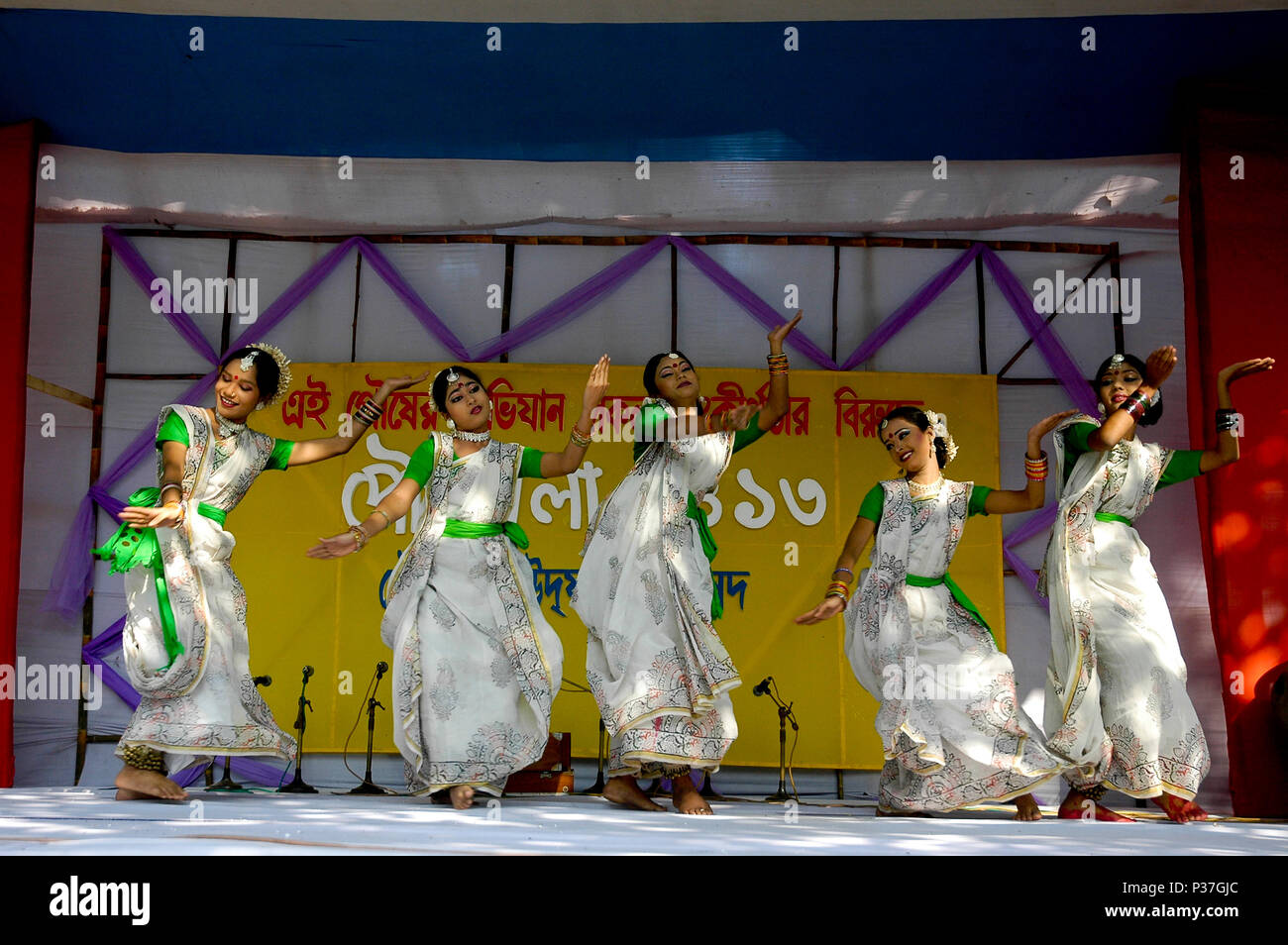 Girls perform at Poush Mela 1414 at Ramna Botomul in Dhaka, the capital ...