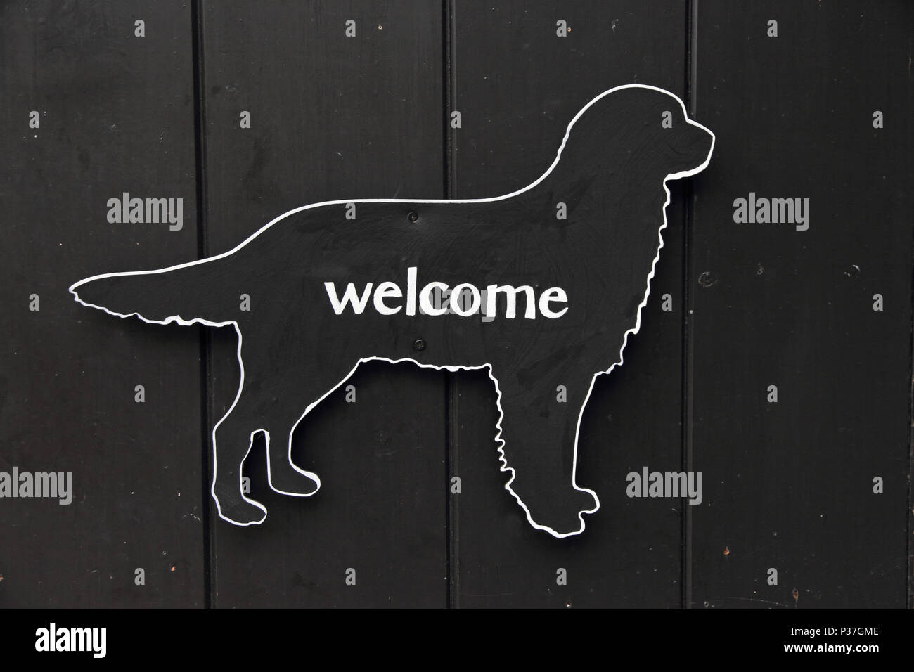 Dogs Welcome sign Stock Photo - Alamy